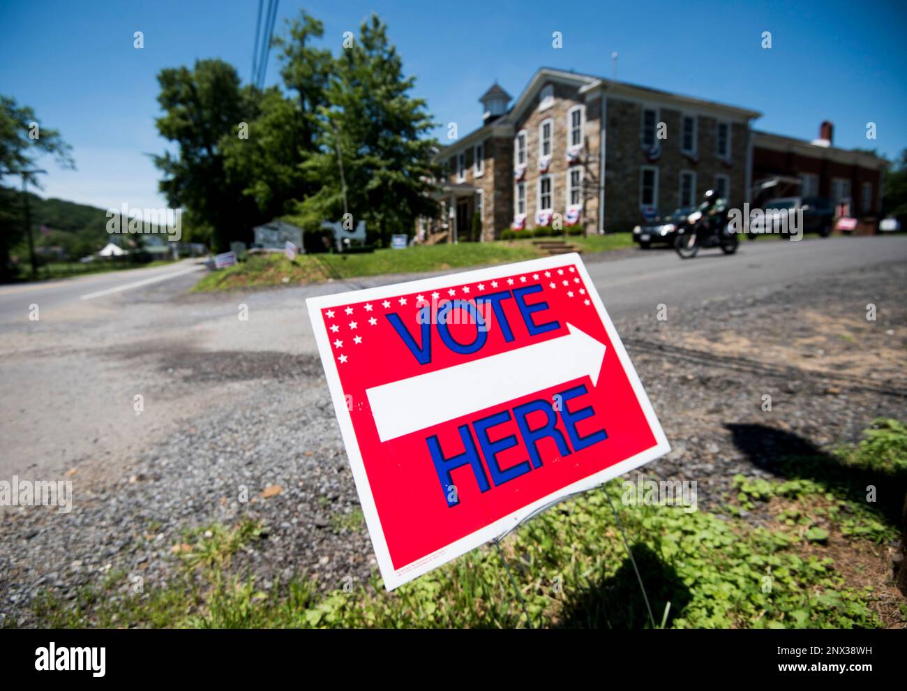 UNITED STATES - JUNE 12: A "vote here" sign stands at the entrance to ...