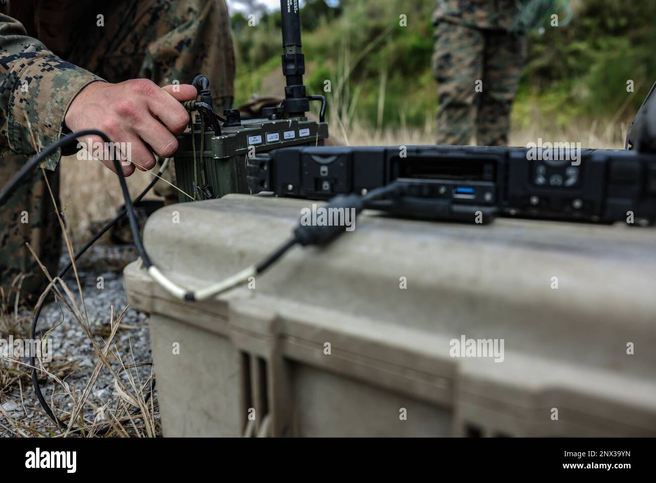 U.S. Marine Corps Lance Cpl. William Phillips, a radio operator with ...