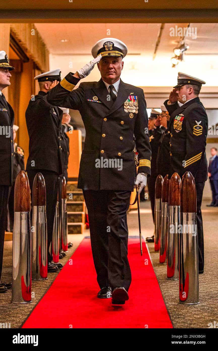 Rear Adm. Mark Sucato, commander, Navy Region Northwest, salutes ...