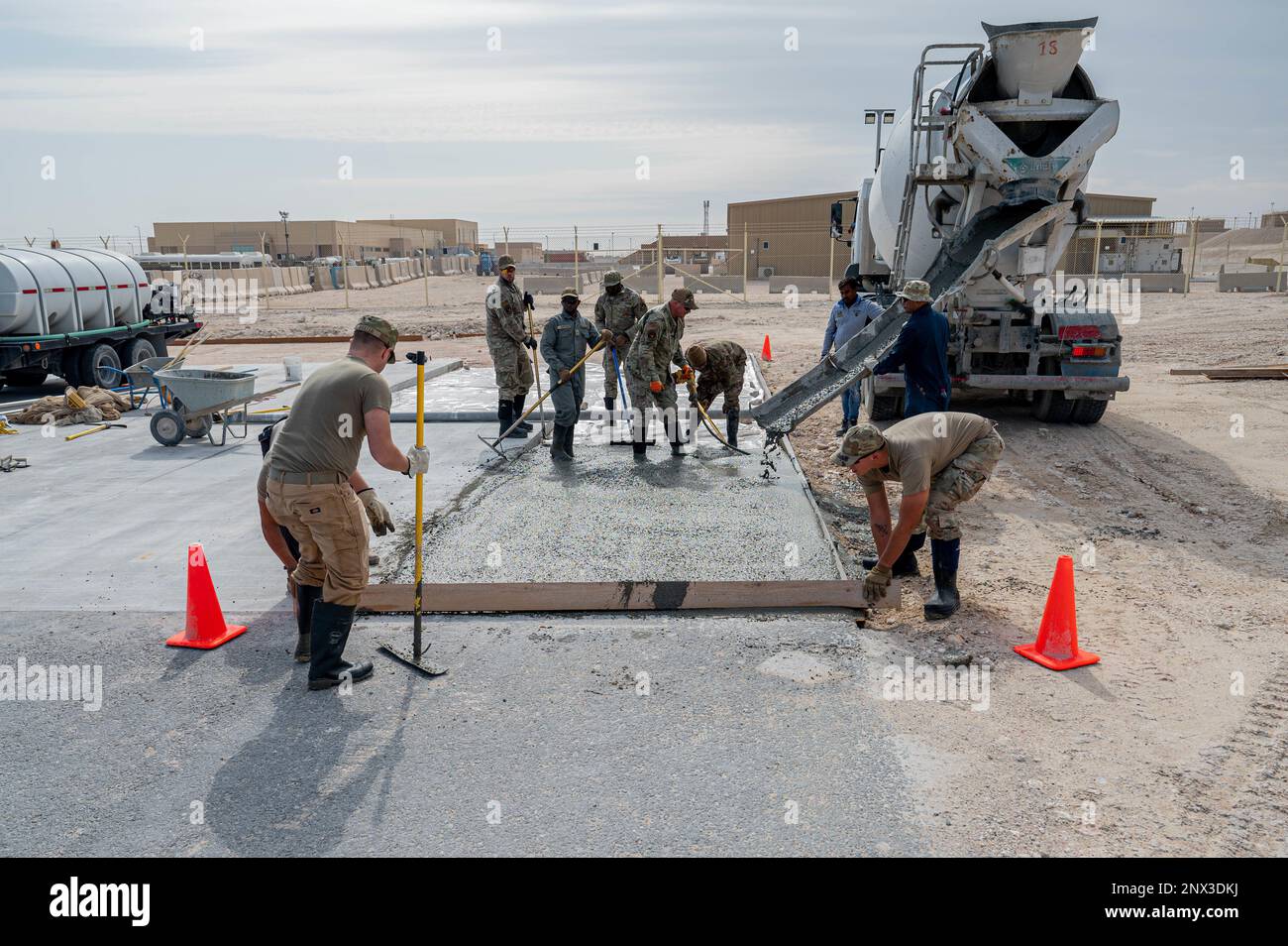 379th Expeditionary Civil Engineer Squadron Airmen lay concrete at the ...