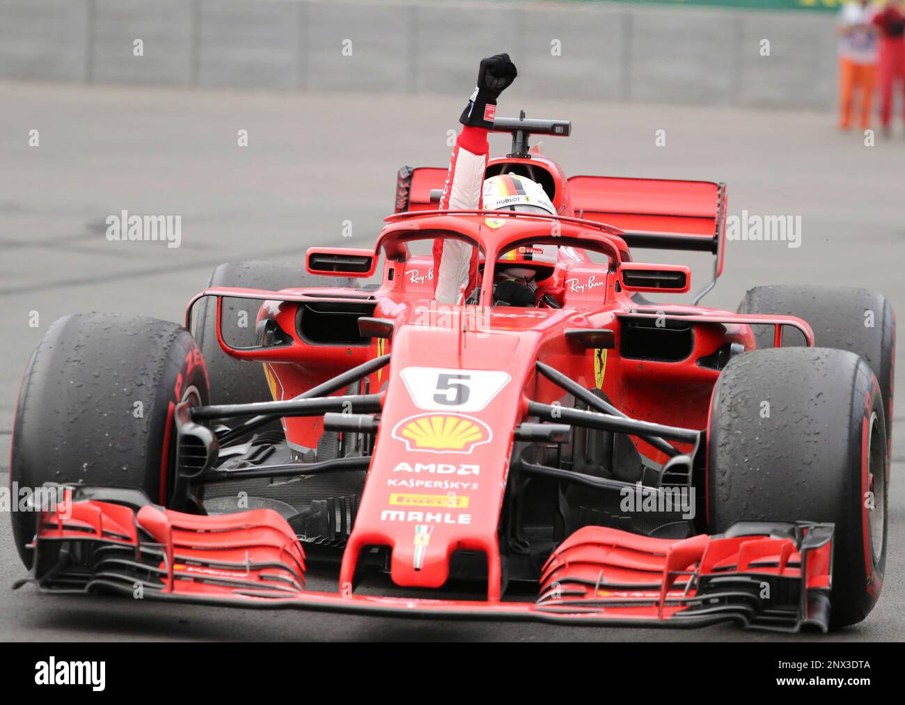 Ferrari driver Sebastian Vettel of Germany celebrates as he drives ...
