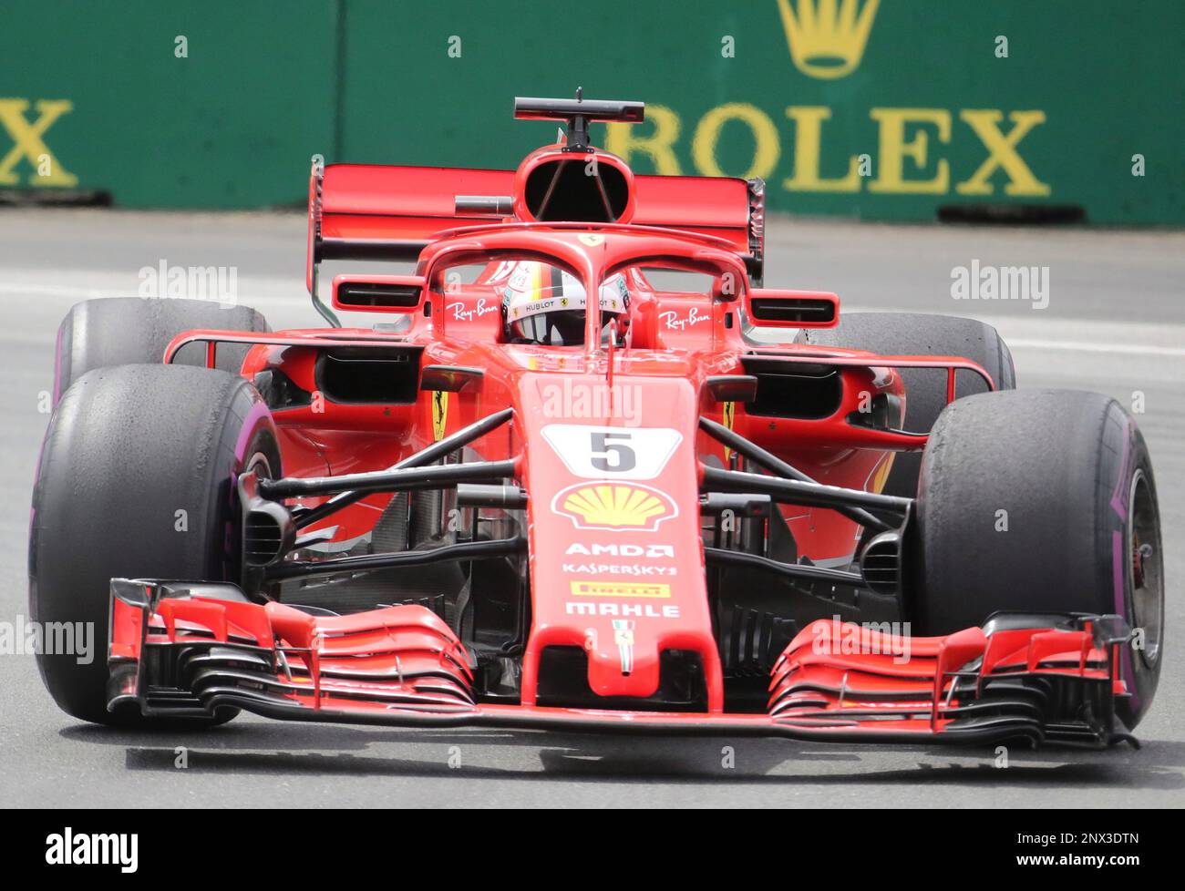 Ferrari driver Sebastian Vettel, of Germany, drives through the hairpin ...
