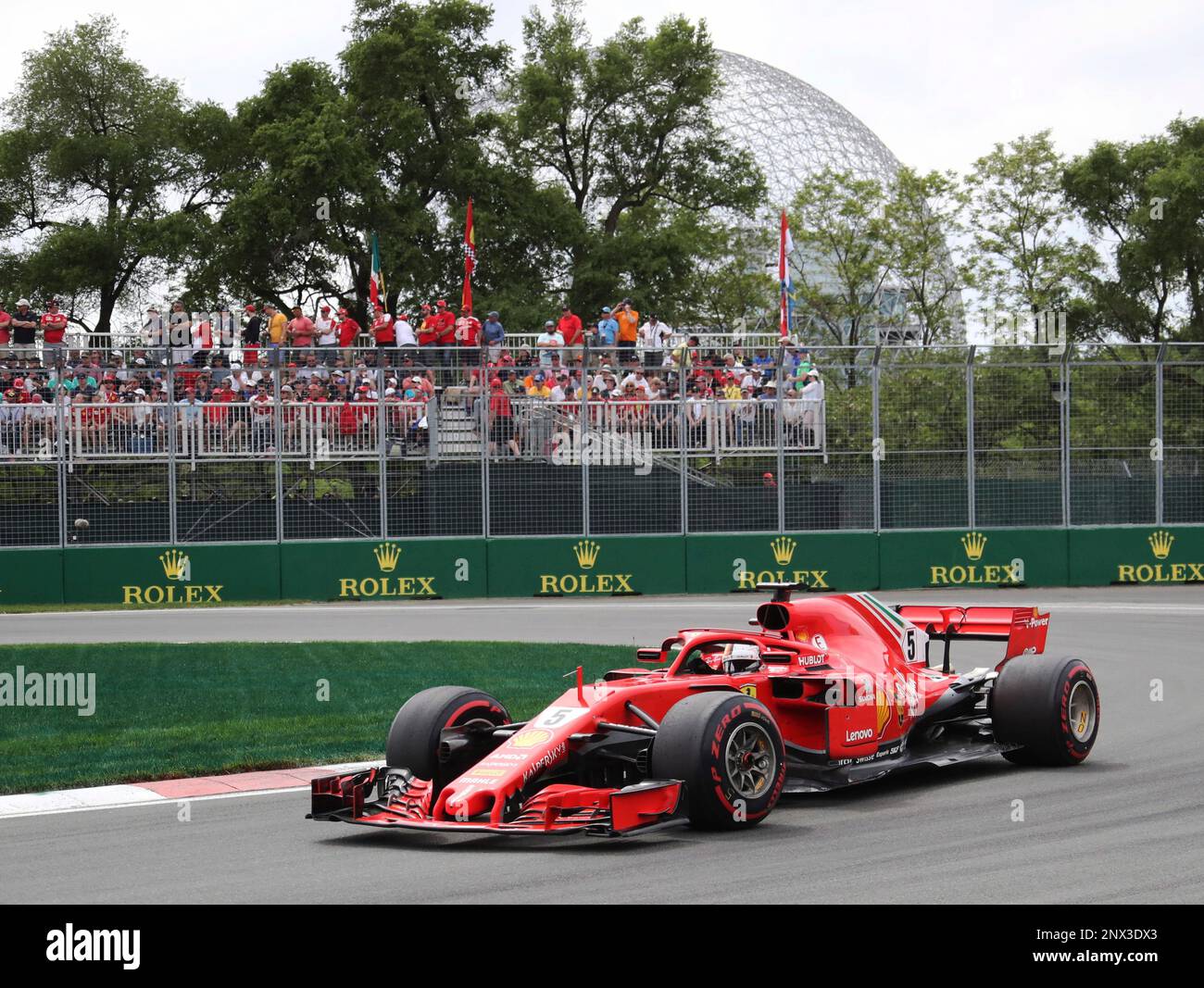 Ferrari driver Sebastian Vettel, of Germany, drives through the hairpin ...