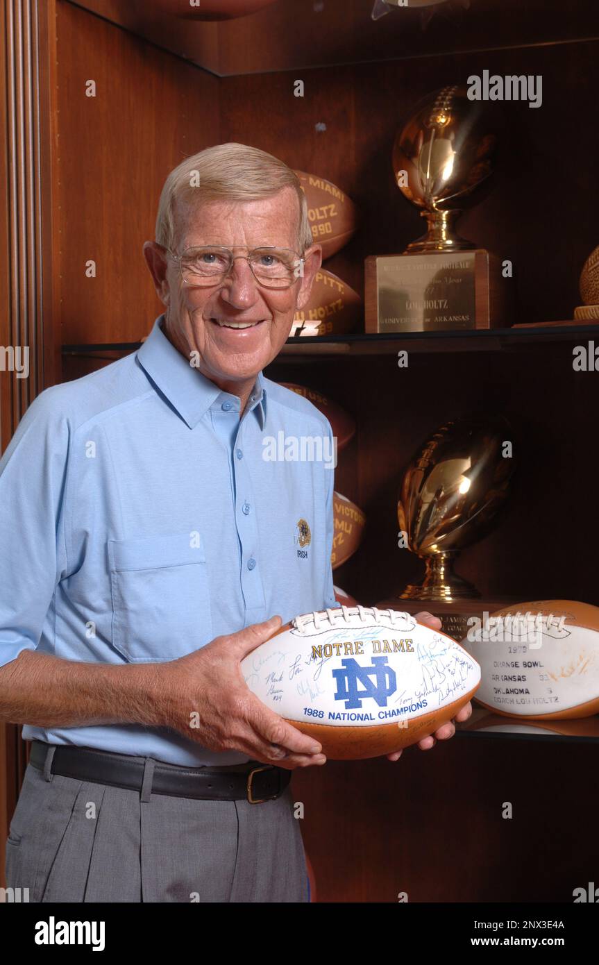 Former college head football coach Lou Holtz stands inside his home ...