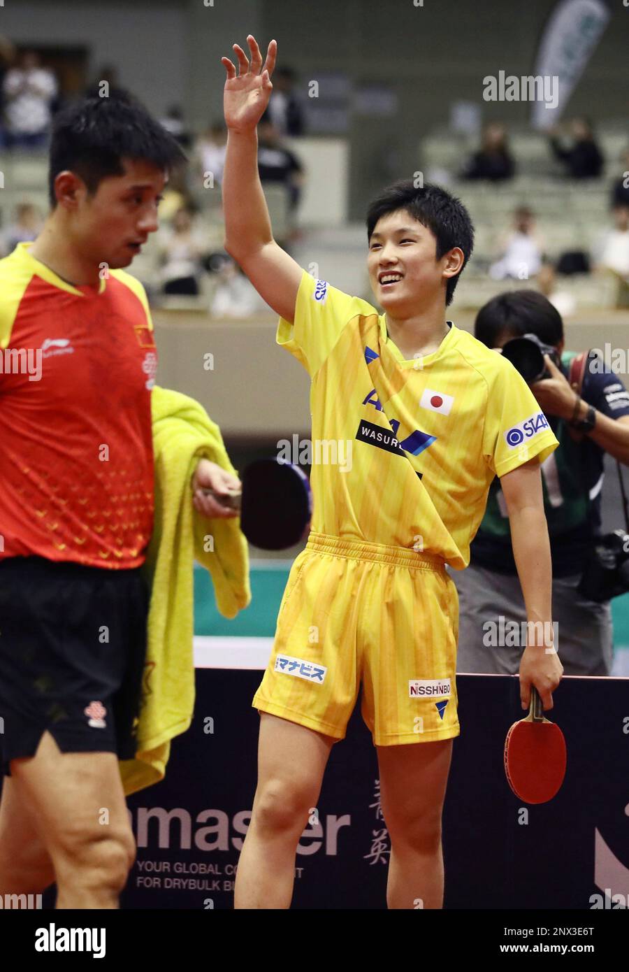 Japanese Tomokazu Harimoto waves his hand after winning the final match ...