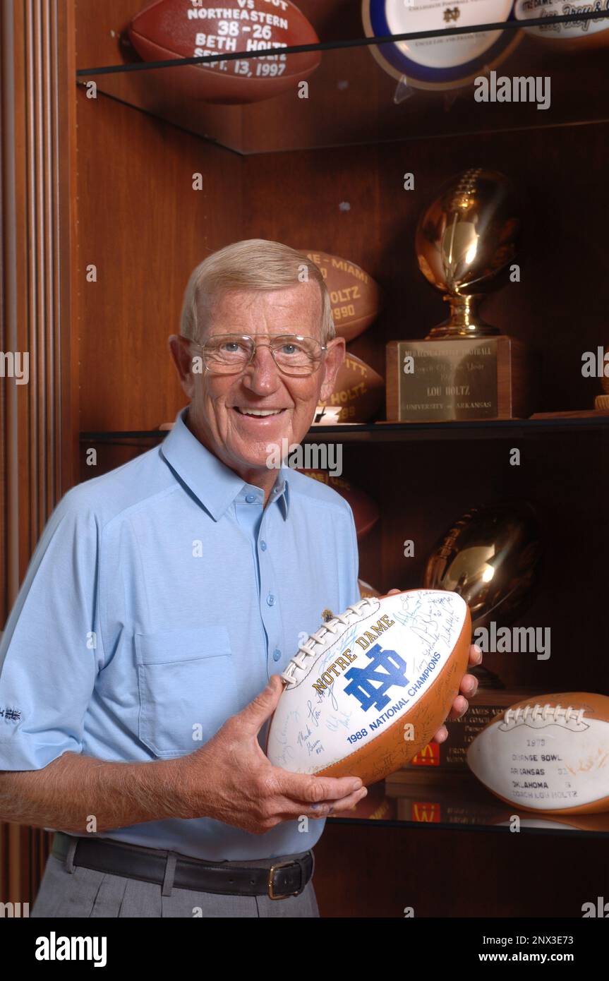 Former college head football coach Lou Holtz stands inside his home ...