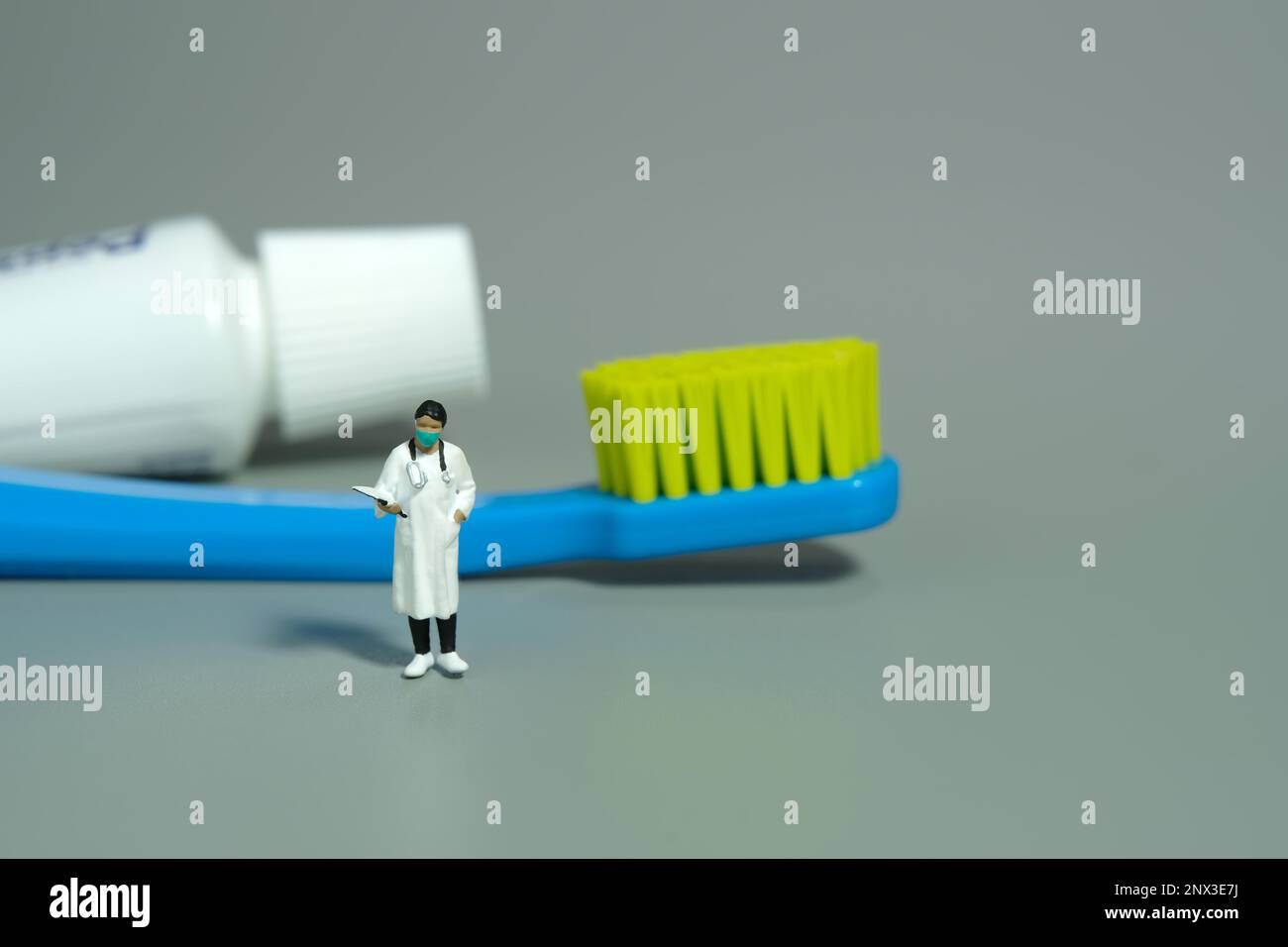 Miniature people toy figure photography. Mouth and teeth health. A ...