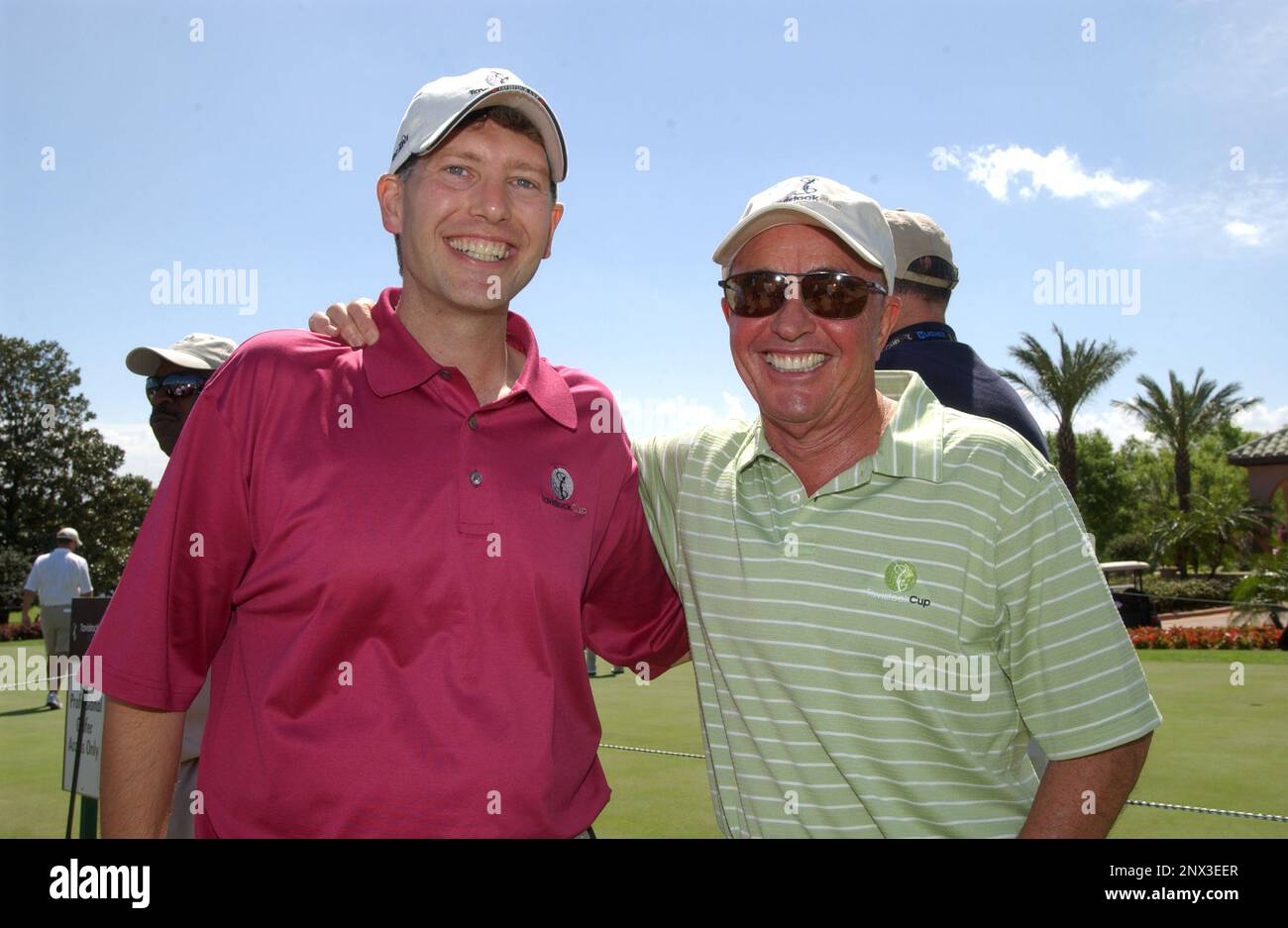 Tavistock Group founder Joe Lewis, right, stands with Tavistock Group ...