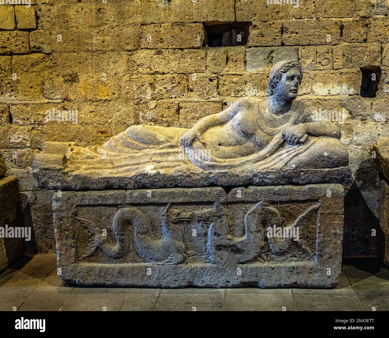 Numerous Etruscan sarcophagi are located along the left aisle of the ...