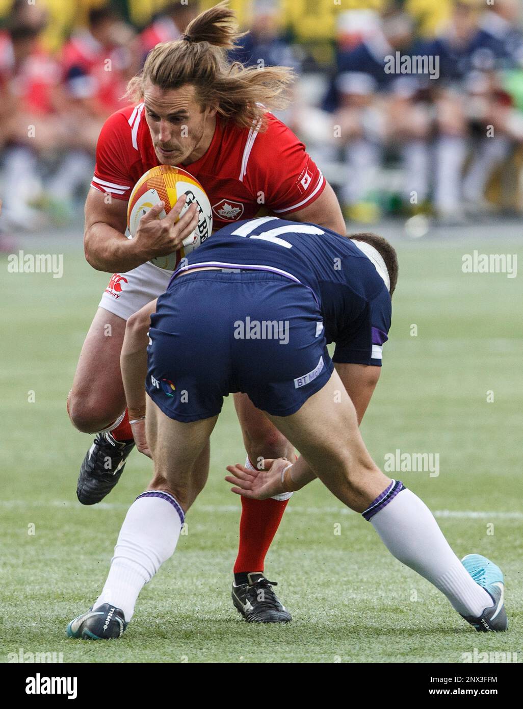 Scotland's James Lang (12) tackles Canada's Jeff Hassler (14) during ...
