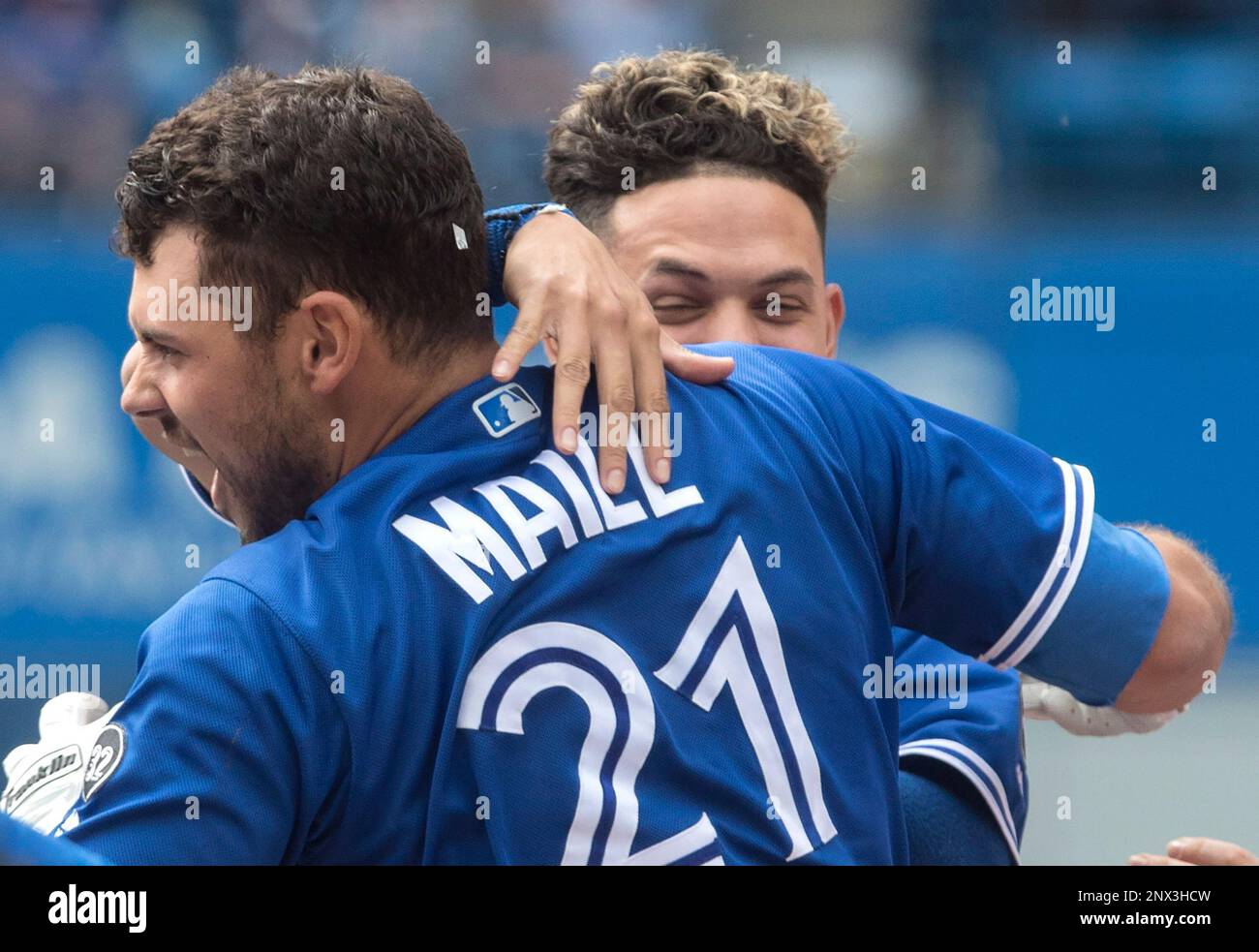 Toronto Blue Jays' Luke Maile (21) celebrates his bases-loaded walkoff ...