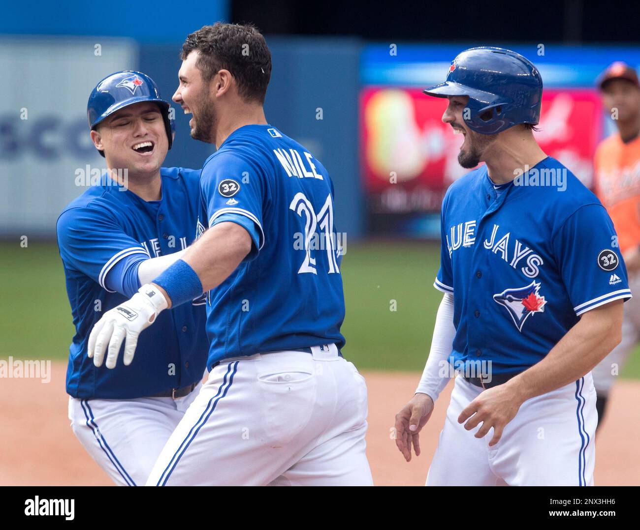 Toronto Blue Jays' Luke Maile (21) celebrates with teammates Randal ...