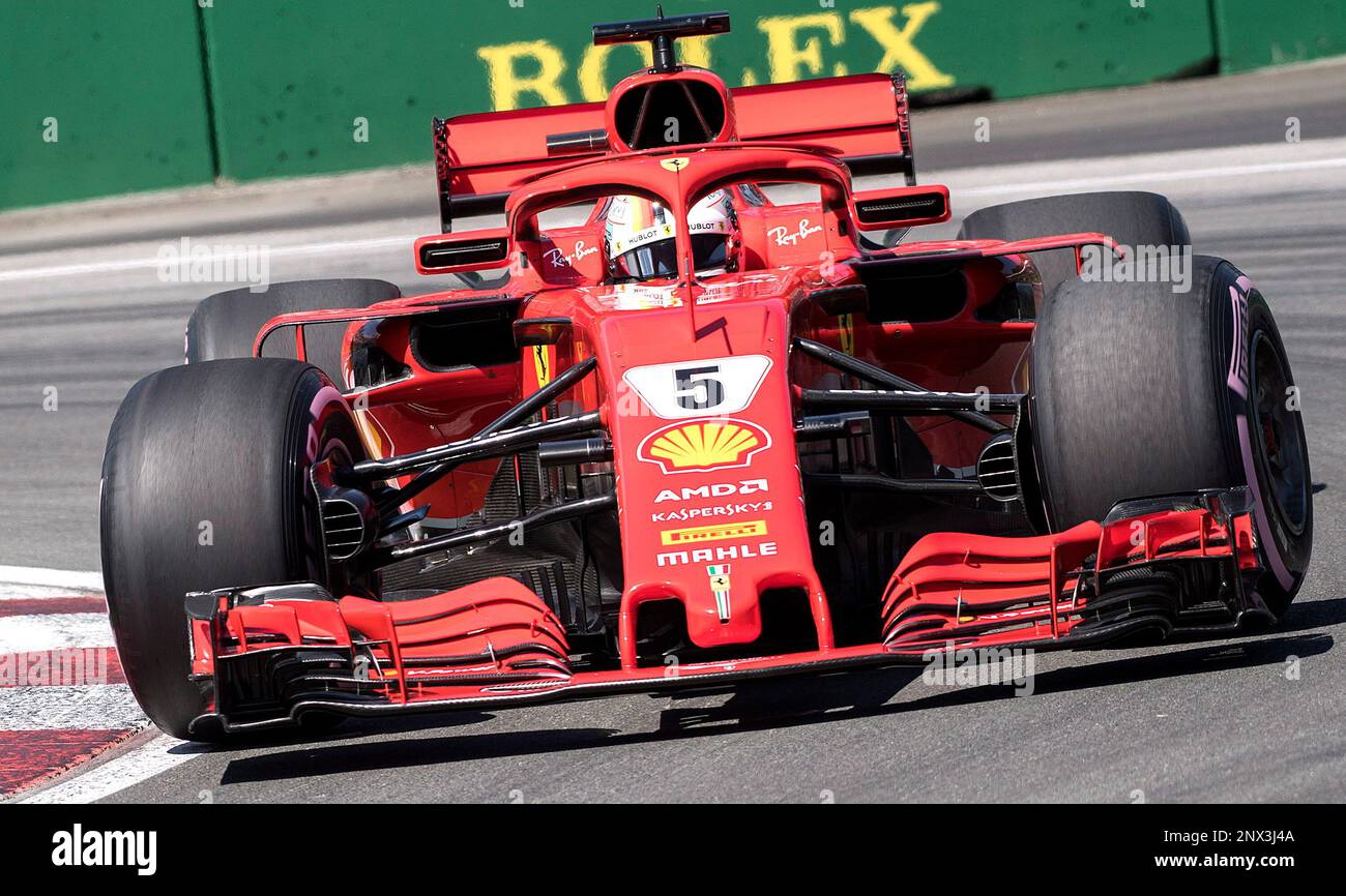 Ferrari driver Sebastian Vettel, of Germany, takes a turn at the ...
