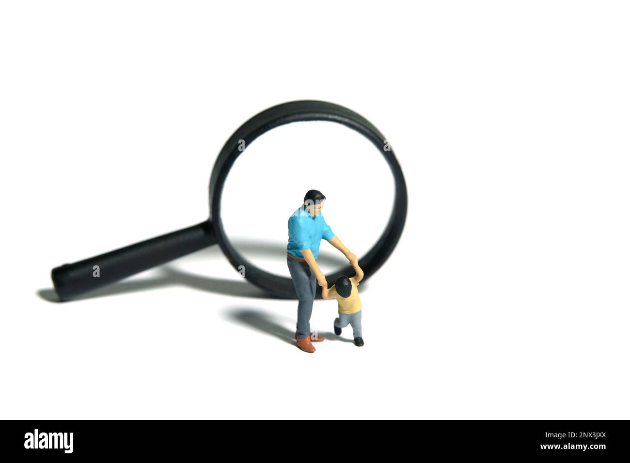 Miniature people toy figure photography. Exploring and play together. A ...