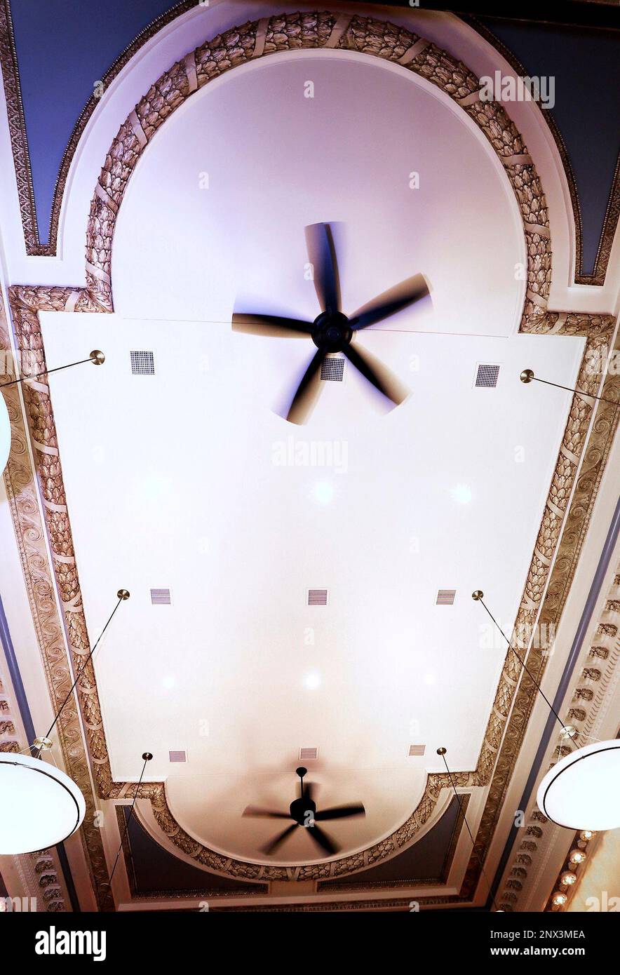 In this Thursday, June 7, 2018 photo, ceiling fans spin with a look ...