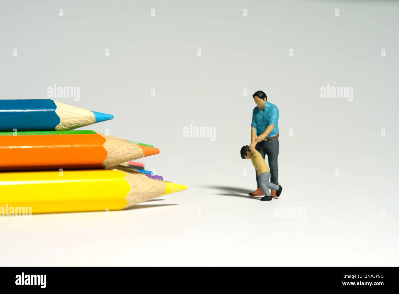 Miniature people toy figure photography. Toddler want to play coloring ...