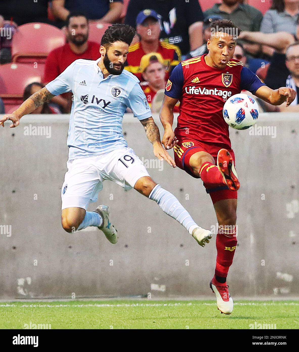 Sporting Kansas City's Cristian Labato, left, works against Real Salt ...
