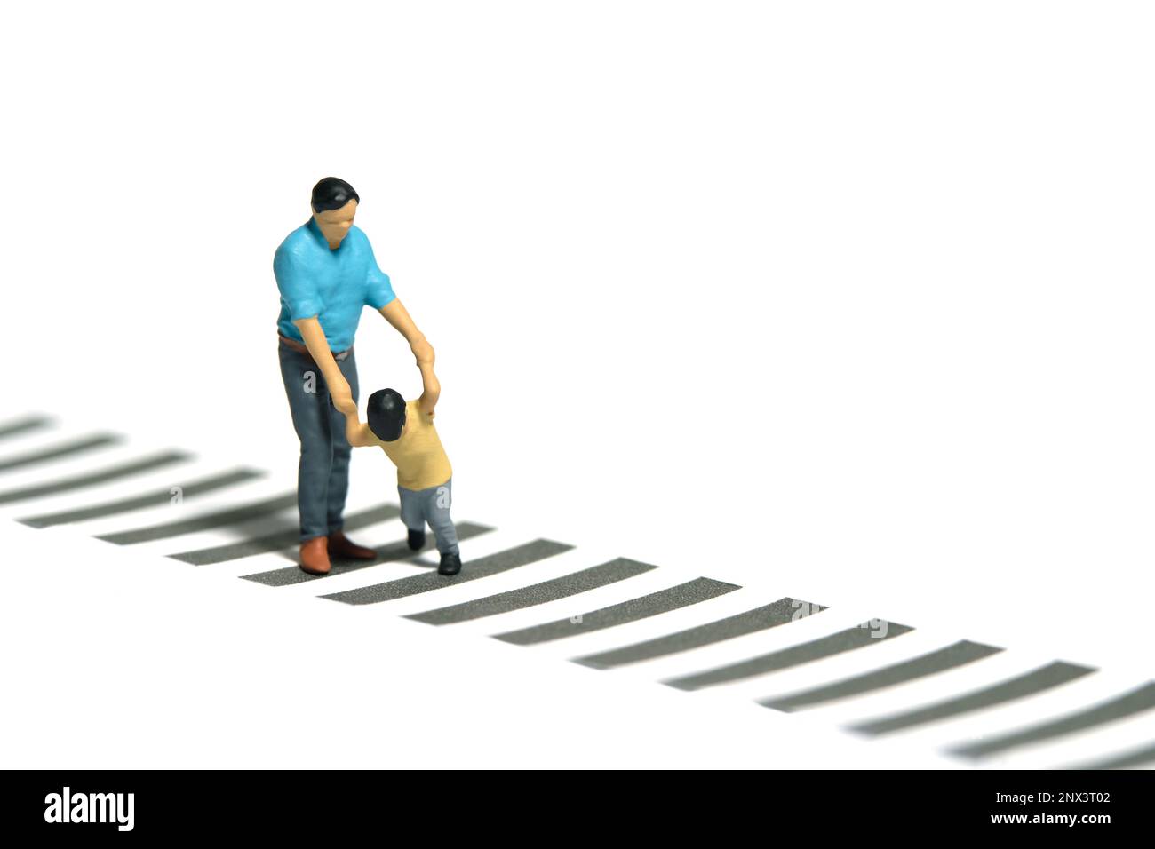 Miniature people toy figure photography. Learning road traffic sign ...