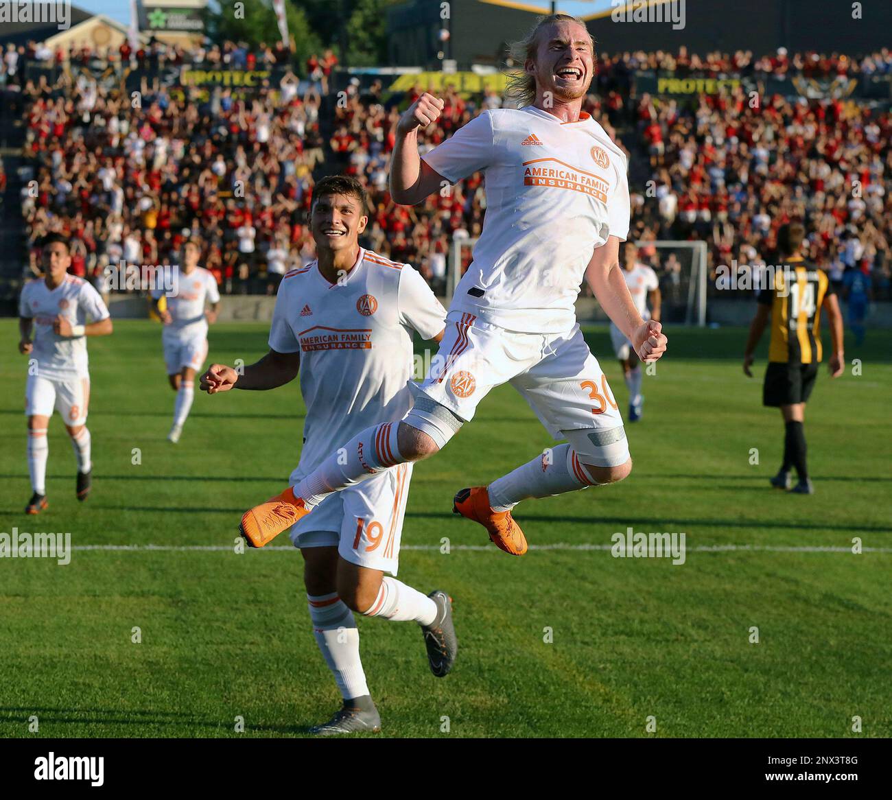 Atlanta United midfielder Andrew Carleton gets some air celebrating his ...