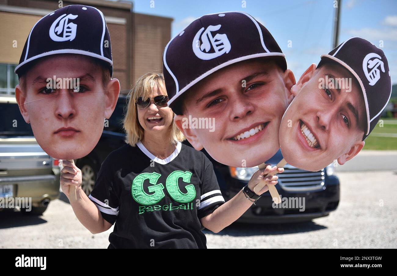 Jan Keeton holds enlarged portraits of her son Griffin Keeton, and ...