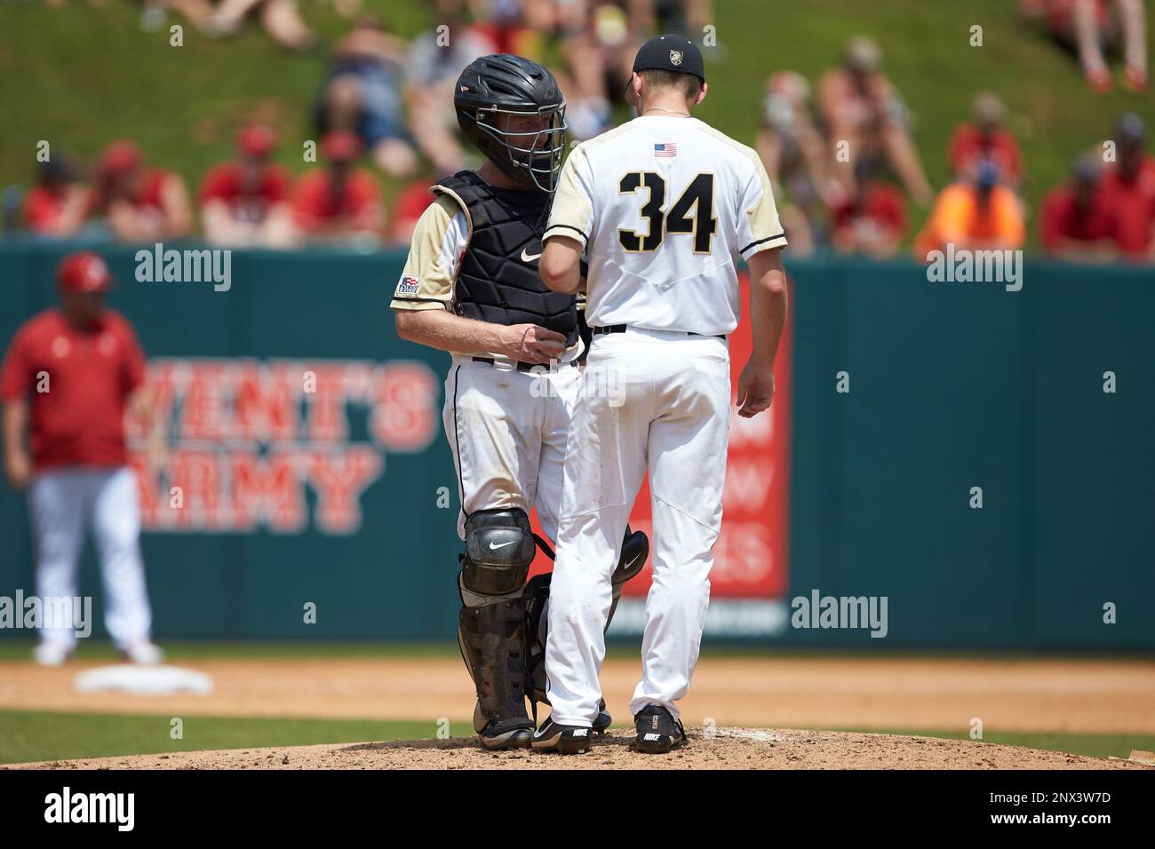 Army Black Knights catcher Jon Rosoff (7) has a meeting on the mound ...