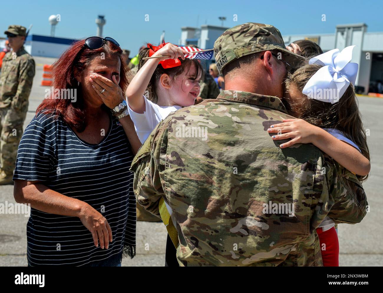 Stacey Duffey, of Florence, Ala., left, reacts as her son, Sgt. Taylor ...