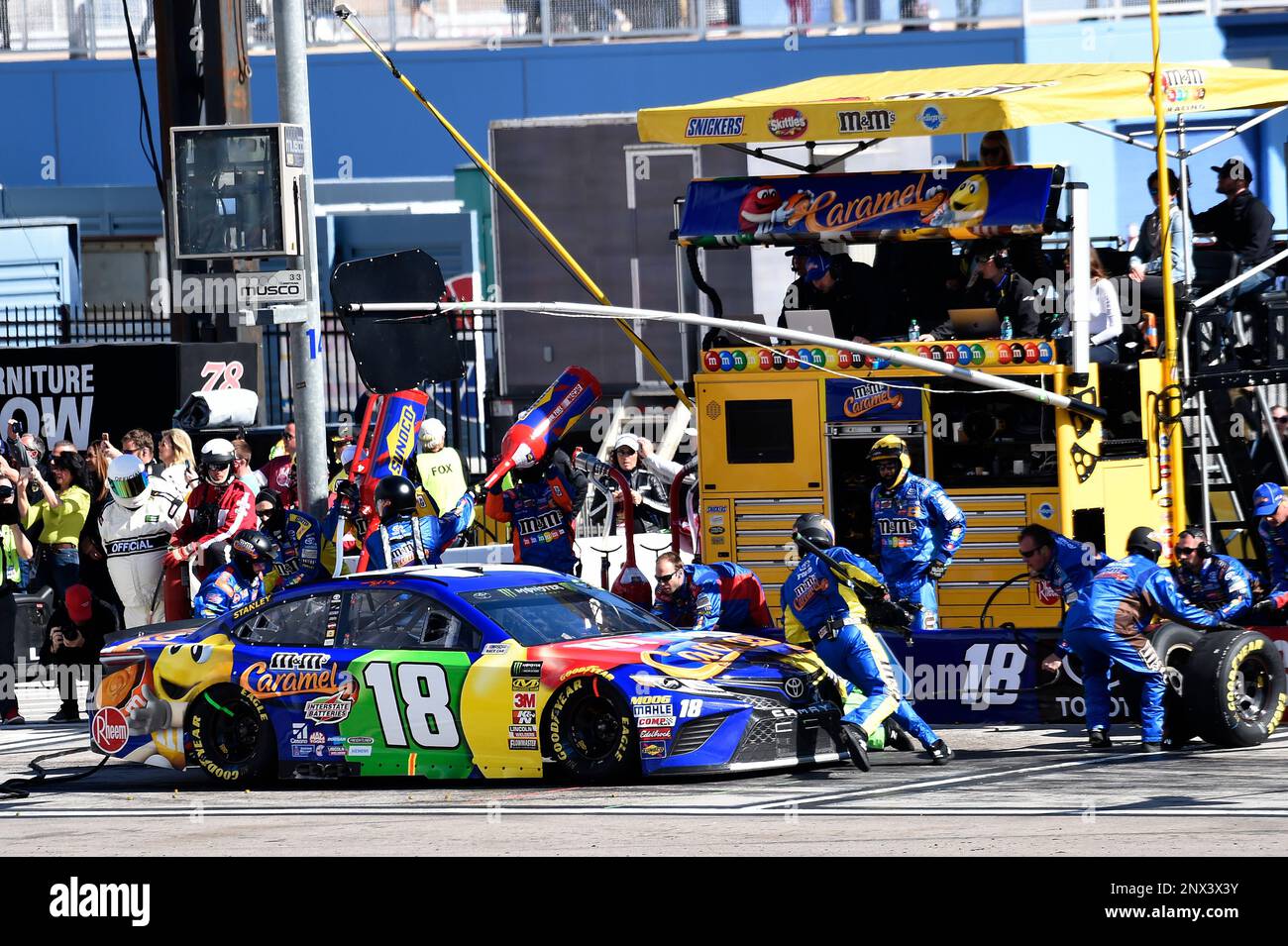 Kyle Busch, Joe Gibbs Racing, Toyota Camry M&M's Caramel makes a pit ...