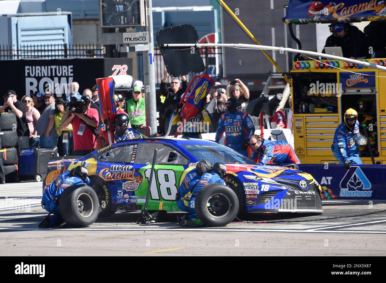 Kyle Busch, Joe Gibbs Racing, Toyota Camry M&M's Caramel makes a pit ...