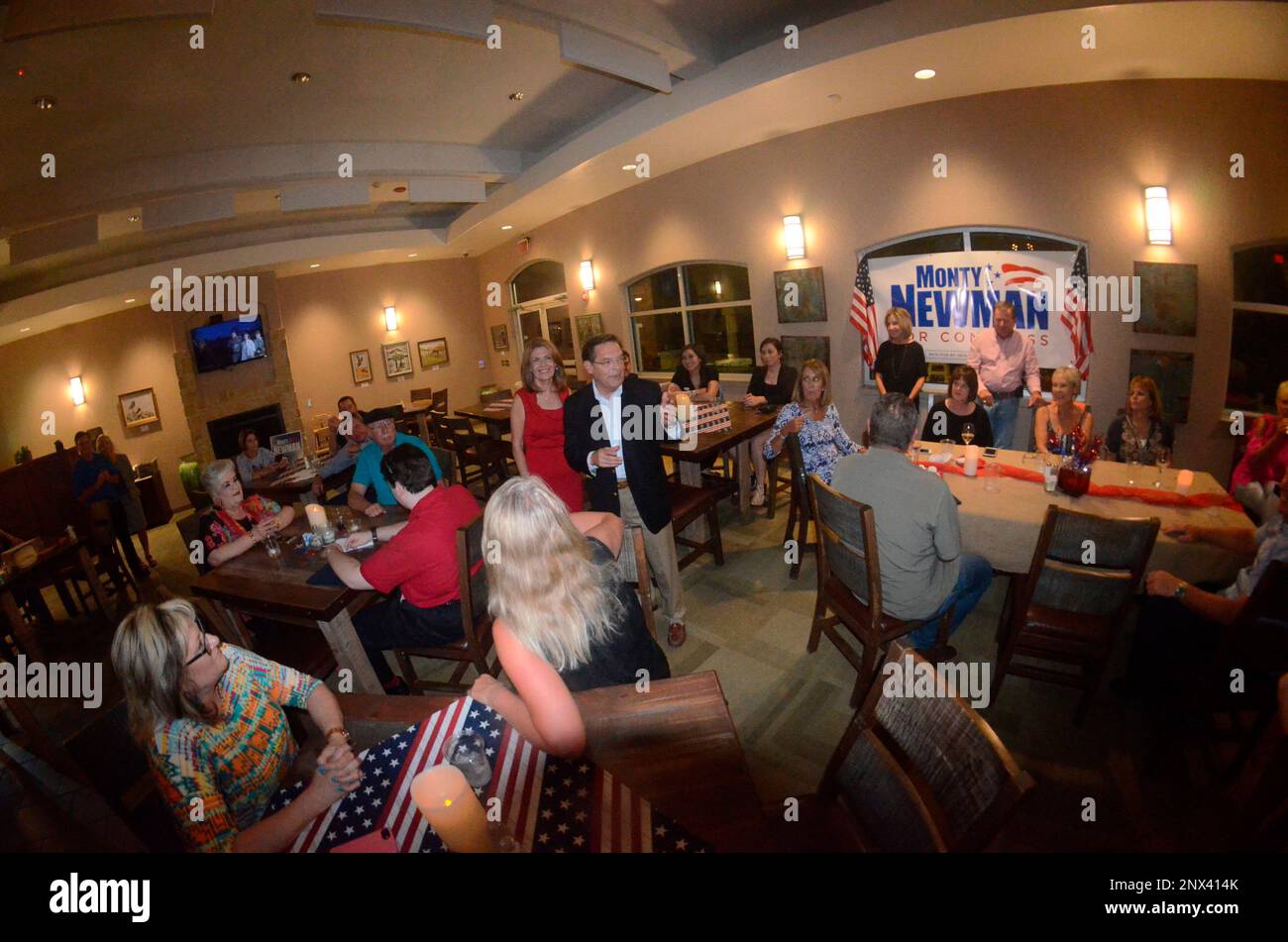 Monty Newman, center, with his wife Vicki, announces to friends and ...