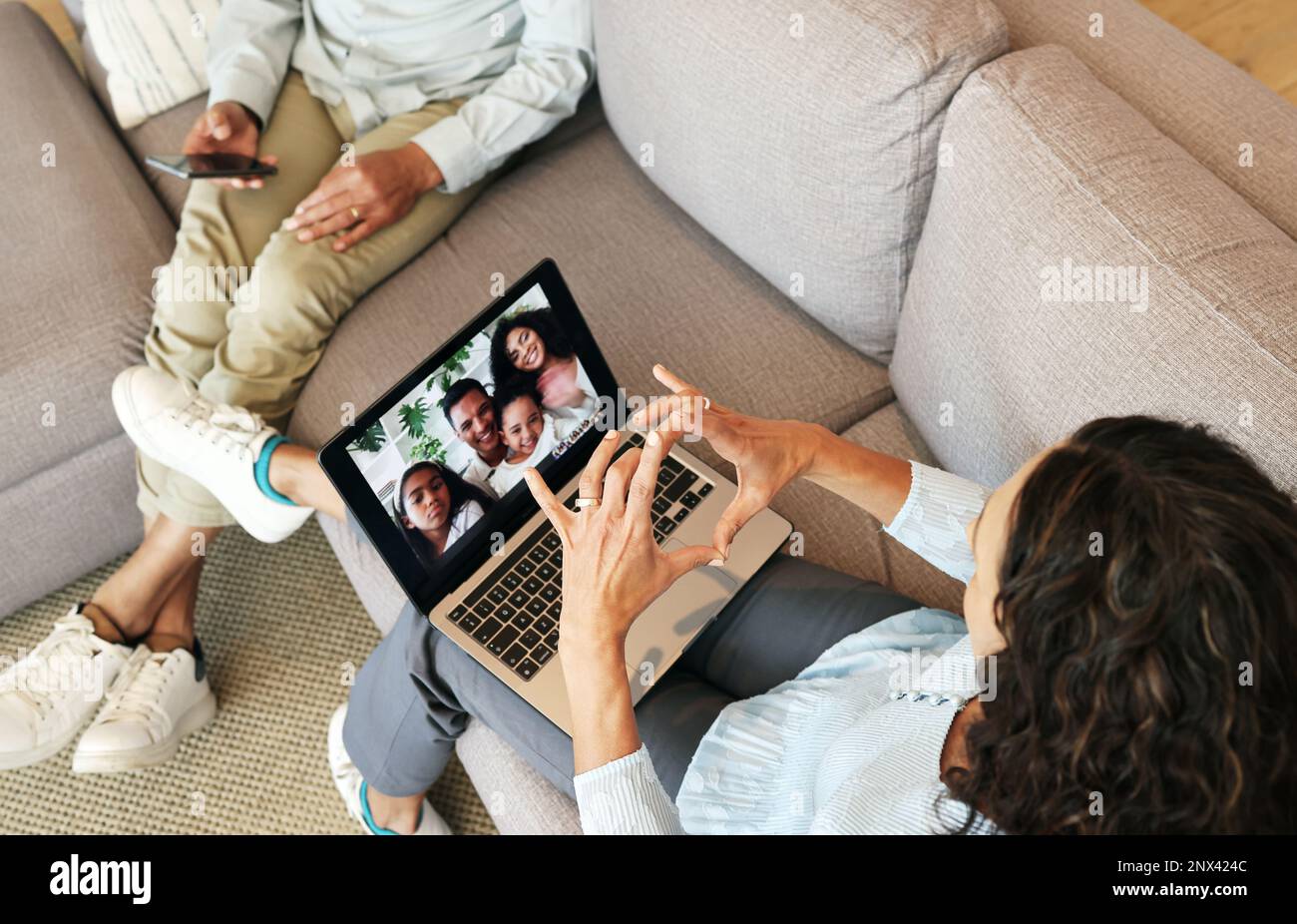 People on video call, family and heart hand with love, laptop screen ...