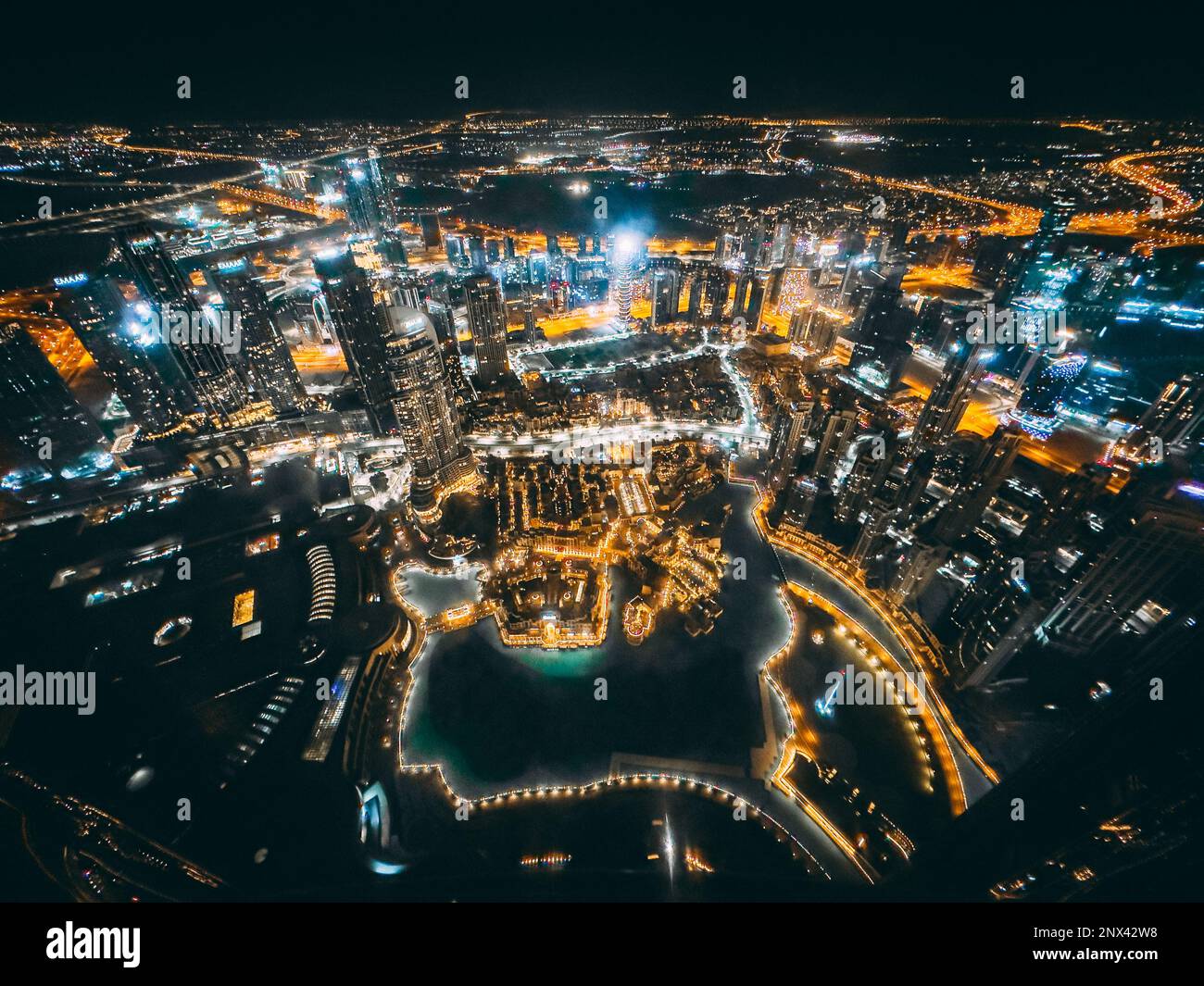 Aerial view of Downtown Dubai with roads, Dubai Mall and the fountain ...