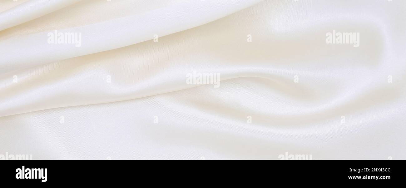 Smooth elegant white silk or satin luxury cloth texture can use as ...