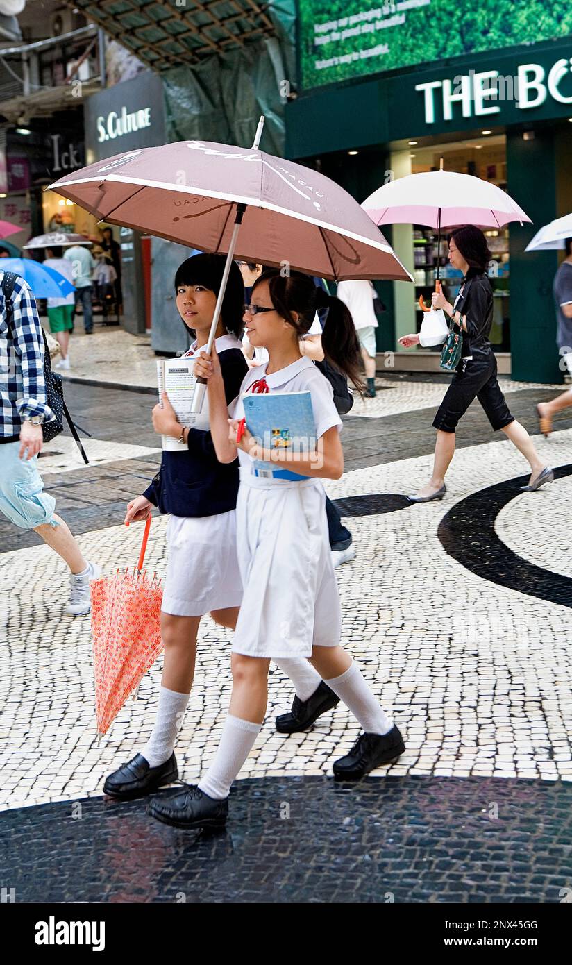 Students in Rue de Sao Domingos, The main shopping street in Macao ...