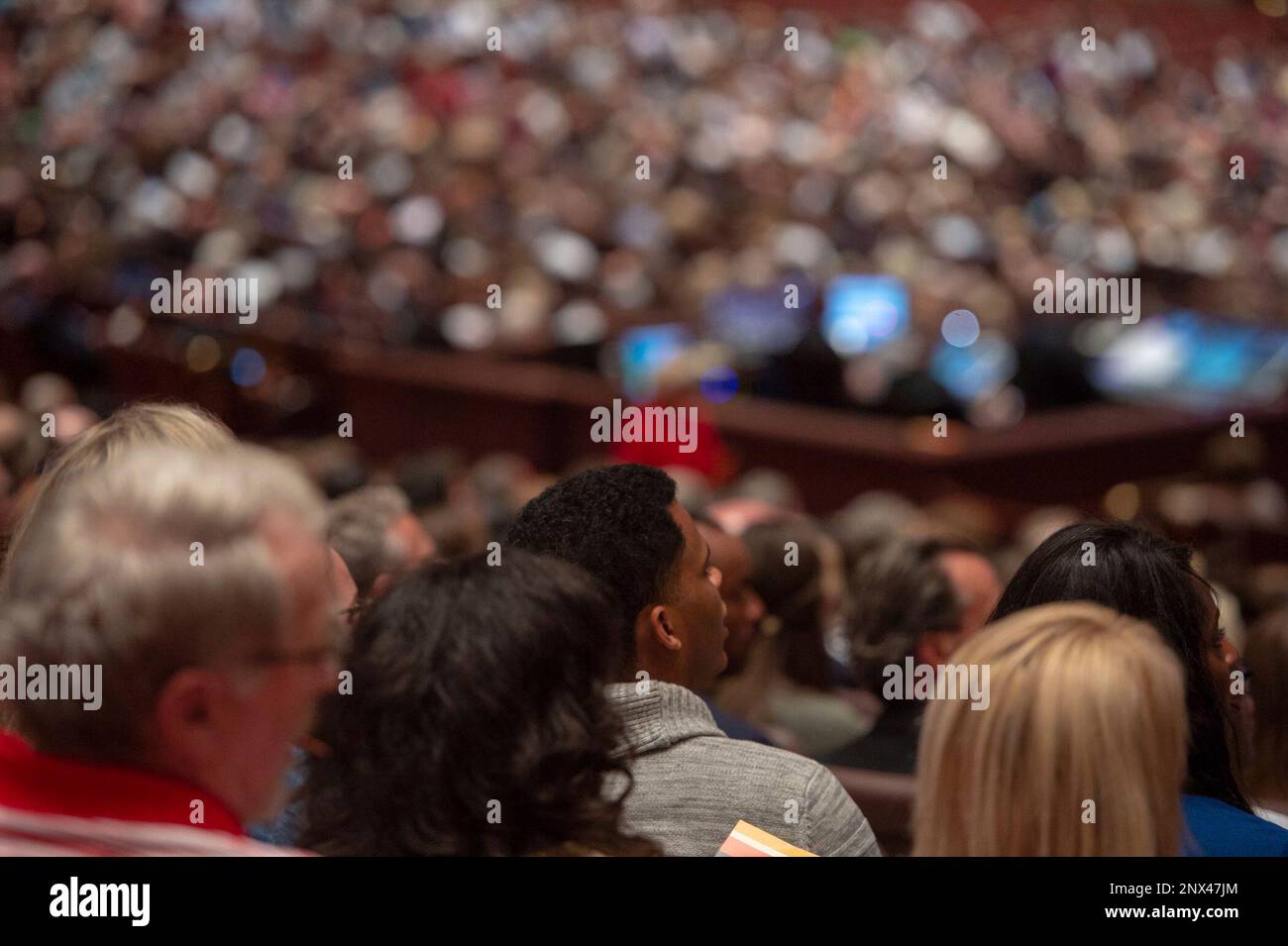 An attendee sings along during Be One, an event to celebrate the 40th ...