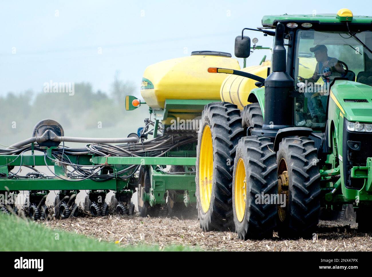 A farmer plants soybeans Friday, May 18, 2018, in an untilled field ...