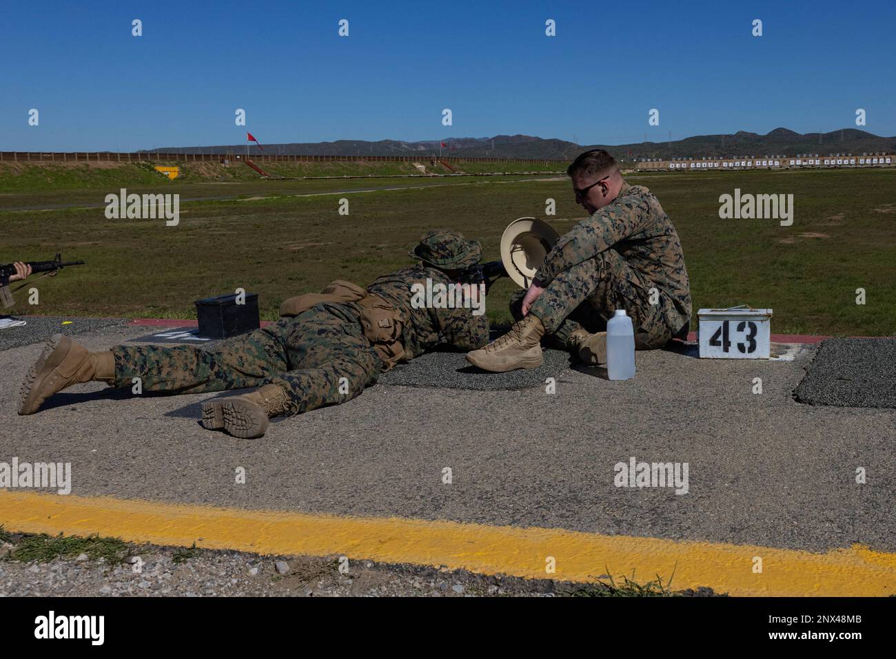 A U.S. Marine Corps range coach with Edson Range, Weapons and Field ...
