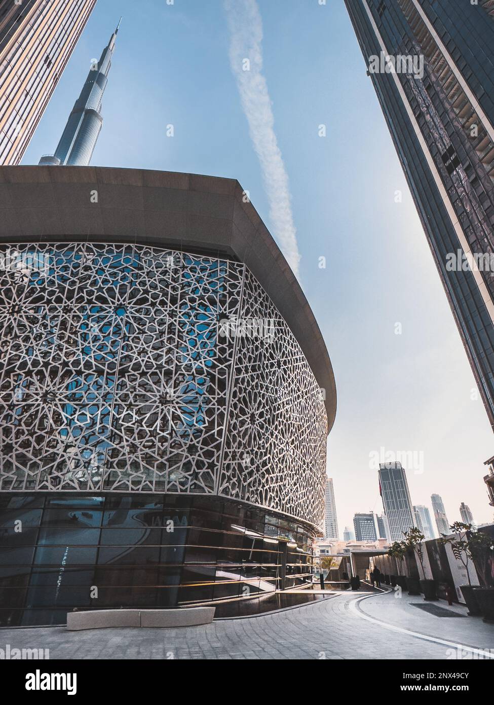 Dubai Opera house in Downtown Dubai, surrounded by skyscrapers and Burj ...