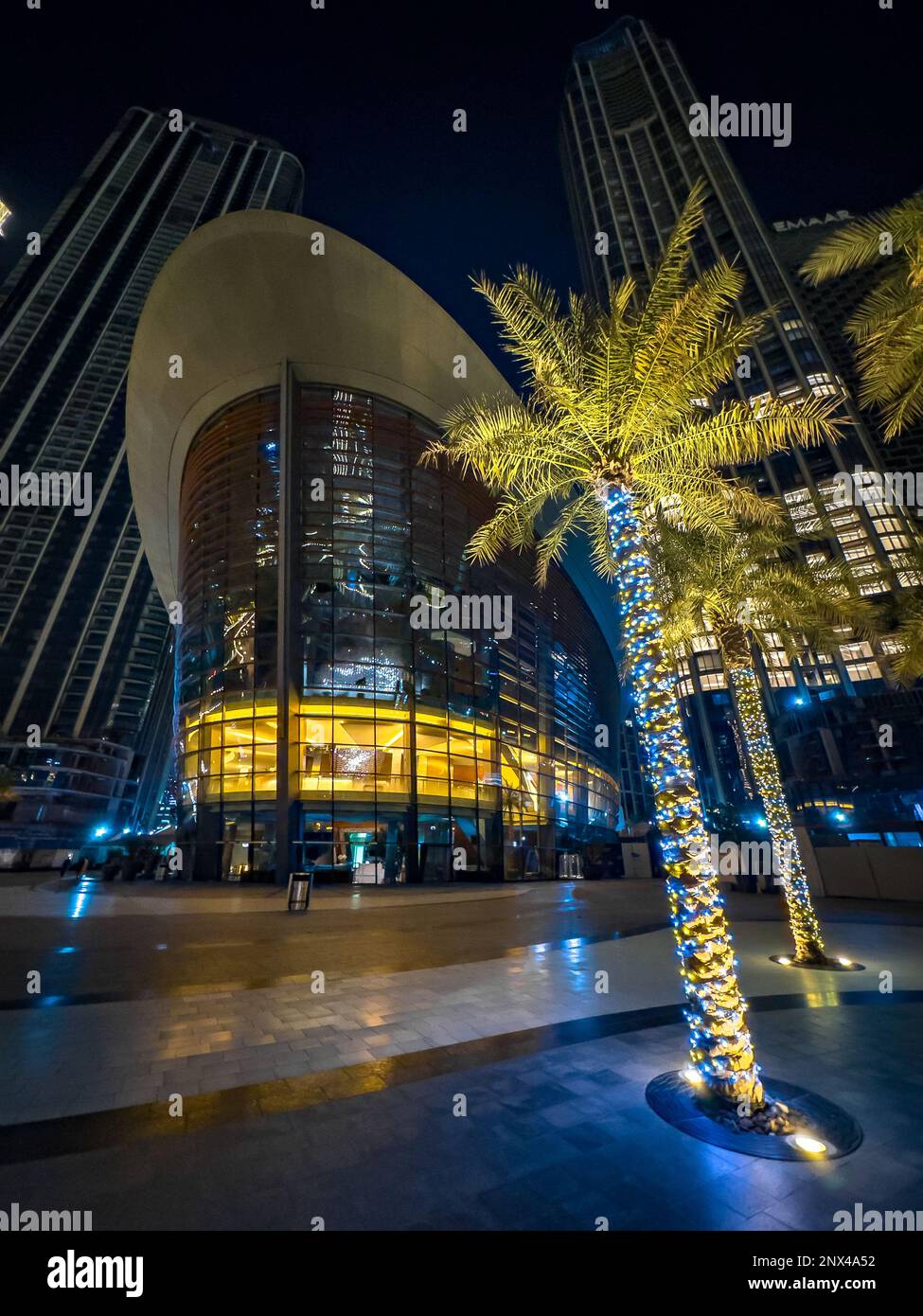 Dubai Opera house by night in Downtown Dubai, surrounded by skyscrapers ...