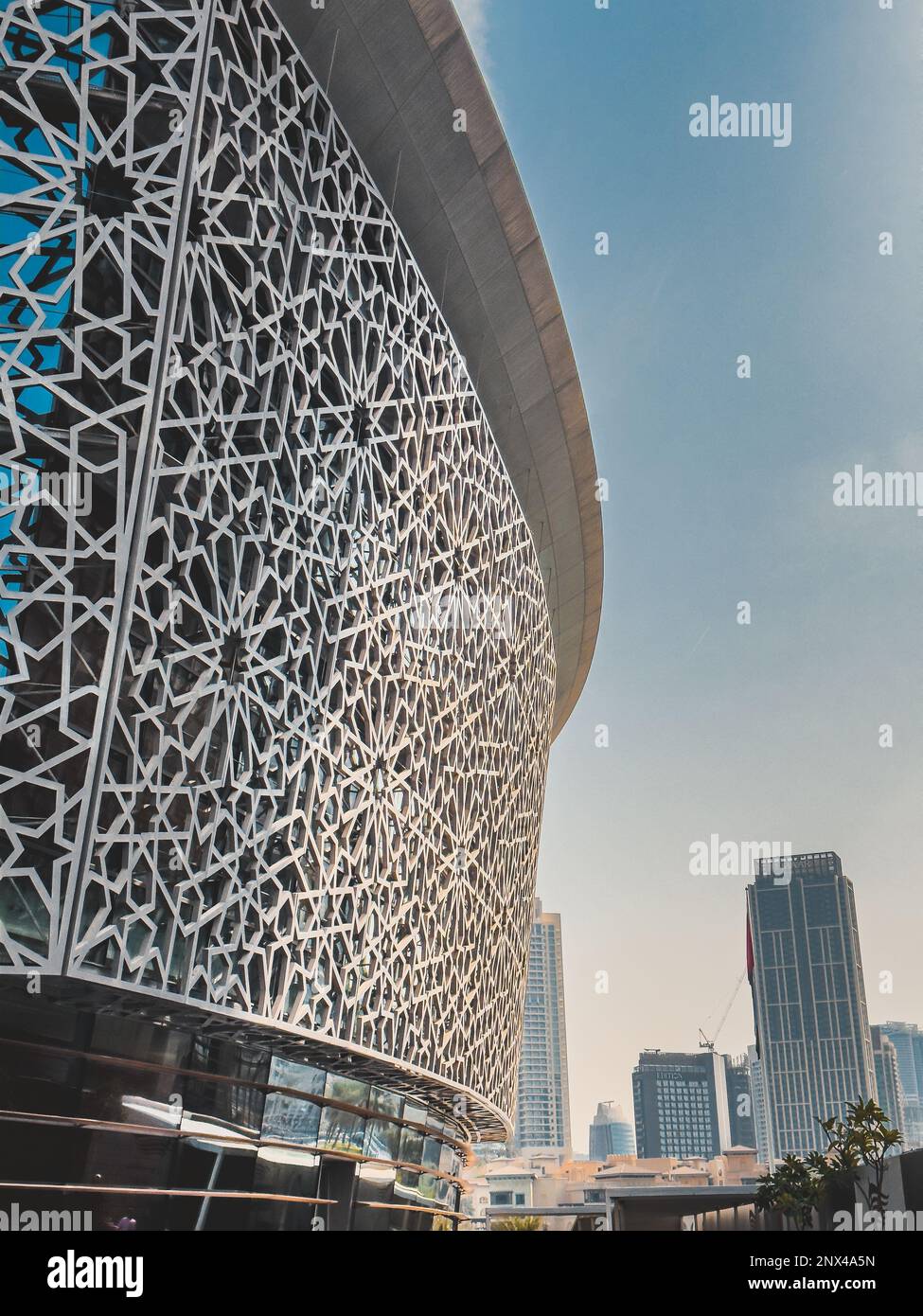 Dubai Opera house in Downtown Dubai, surrounded by skyscrapers and Burj ...