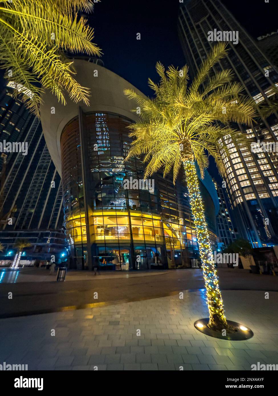 Dubai Opera house by night in Downtown Dubai, surrounded by skyscrapers ...