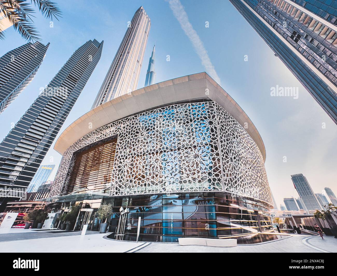 Dubai Opera house in Downtown Dubai, surrounded by skyscrapers and Burj ...