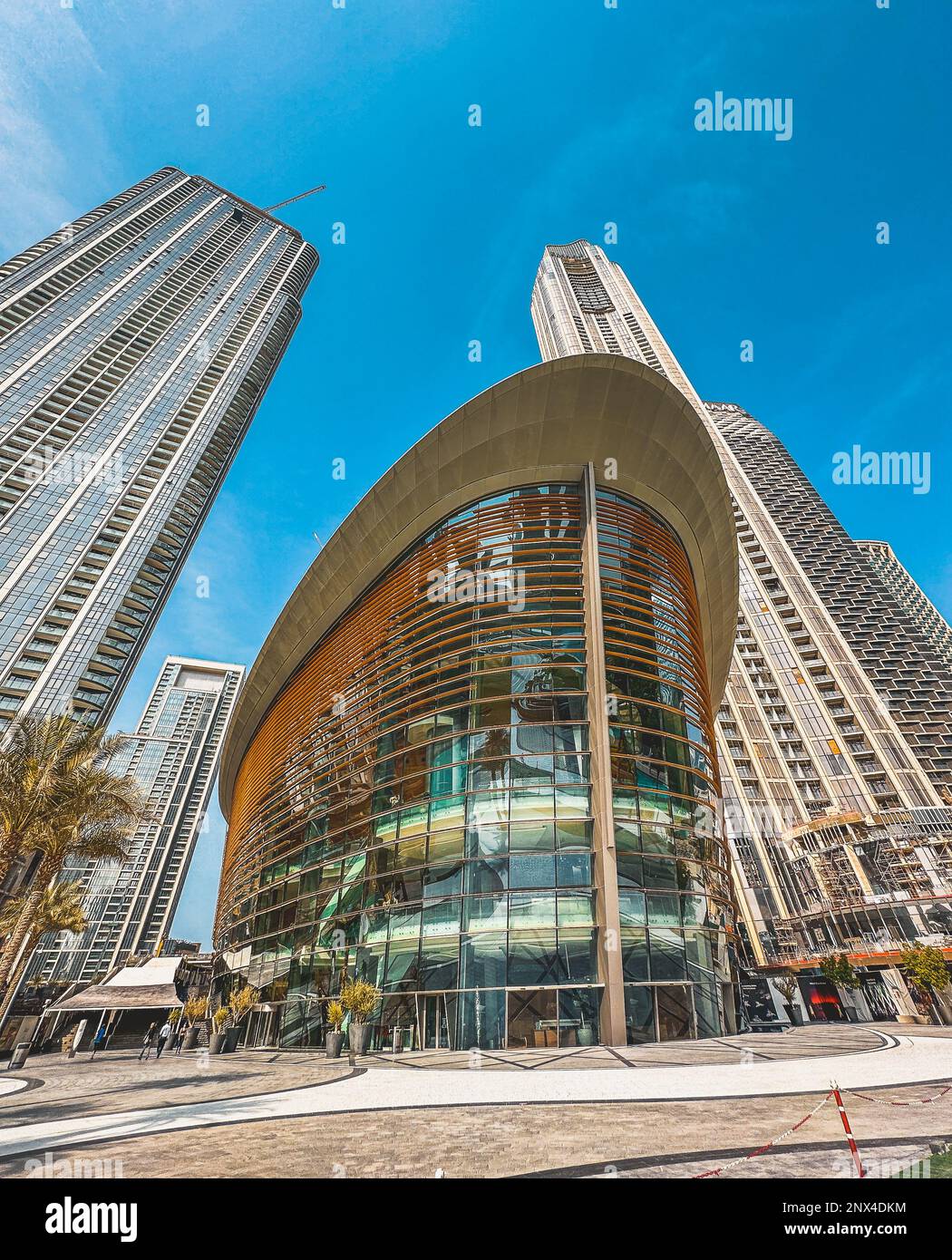 Dubai Opera house in Downtown Dubai, surrounded by skyscrapers and Burj ...