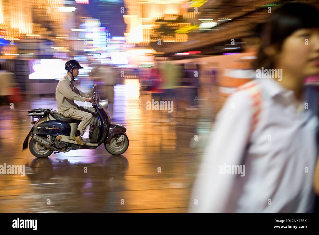 China.Shanghai: Motorcycle in Nanging Road East. the main shoping ...