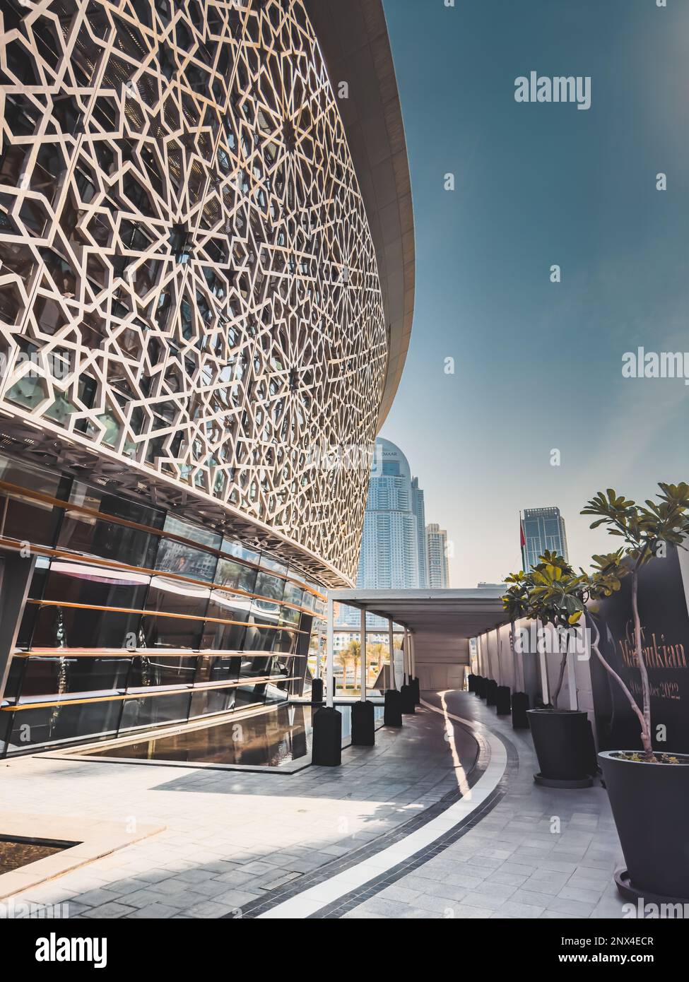Dubai Opera house in Downtown Dubai, surrounded by skyscrapers and Burj ...