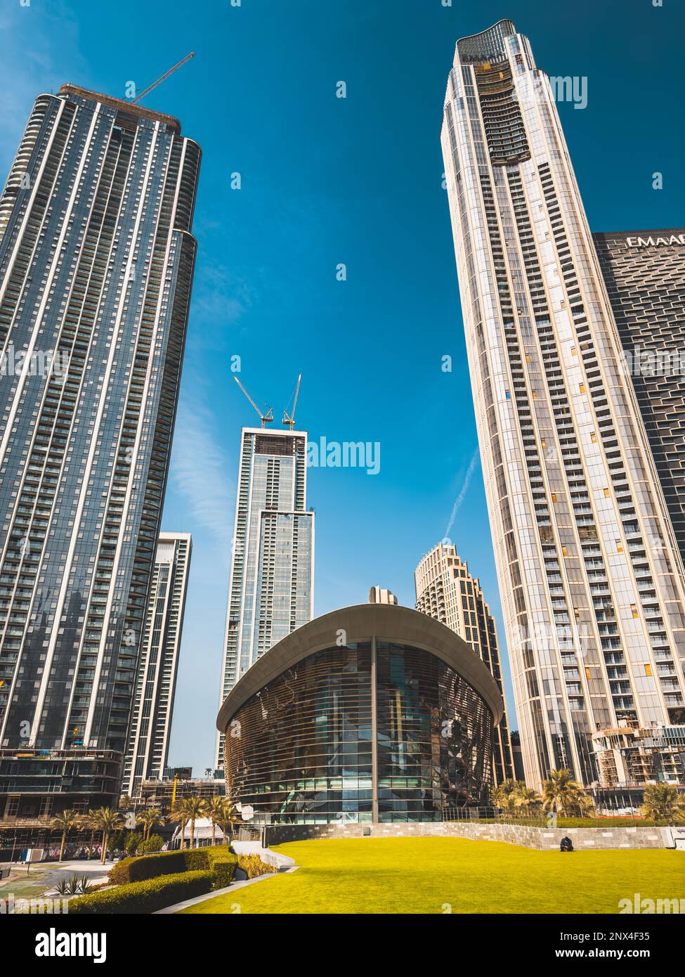 Dubai Opera house in Downtown Dubai, surrounded by skyscrapers and Burj ...
