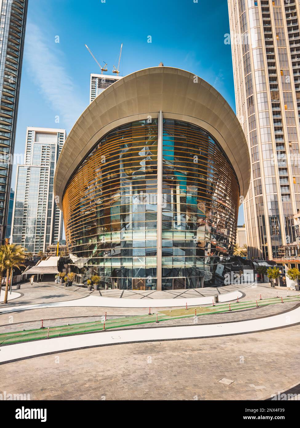 Dubai Opera house in Downtown Dubai, surrounded by skyscrapers and Burj ...