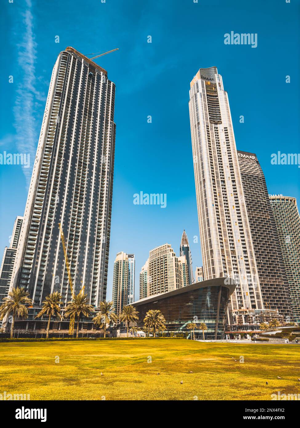 Dubai Opera house in Downtown Dubai, surrounded by skyscrapers and Burj ...