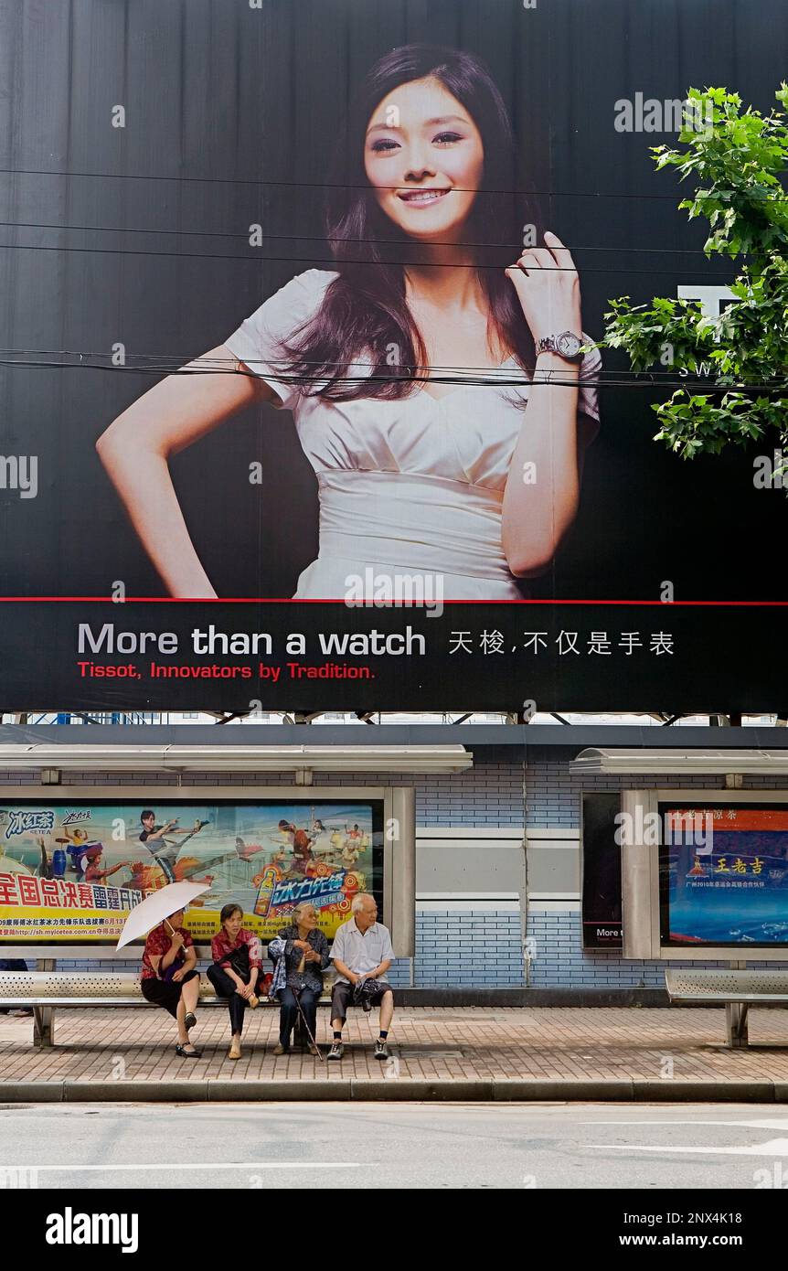 Chinese woman waiting bus stop hi-res stock photography and images - Alamy