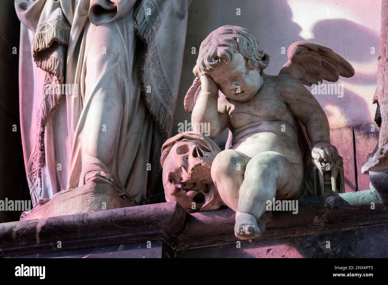 A statue of a cherub and a skull inside the Notre Dame cathedral in ...