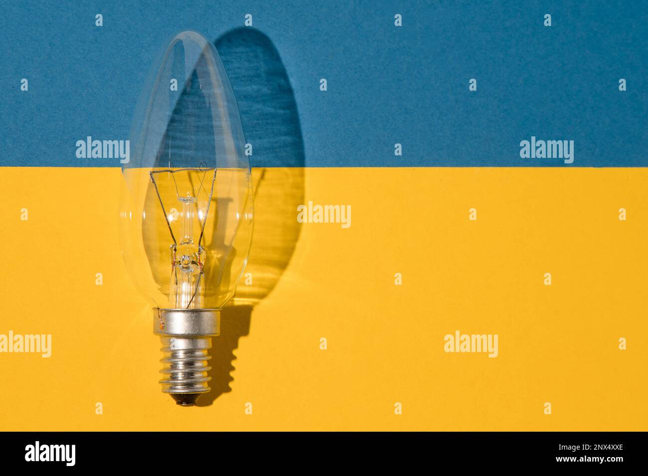 An old glass electric light bulb with a tungsten filament. The concept ...